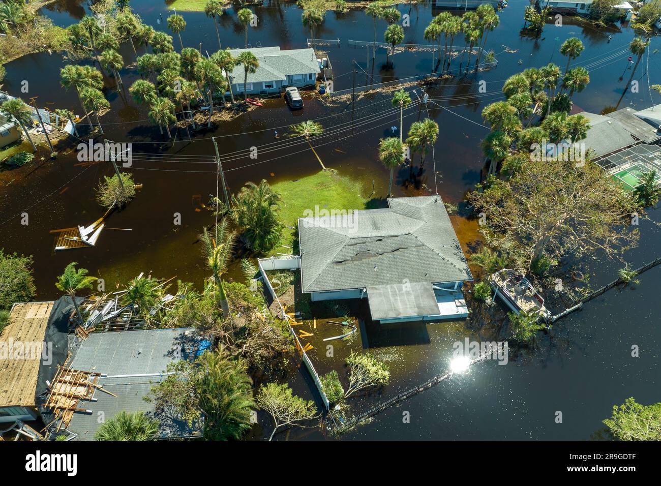 Aftermath of natural disaster. Flooded houses by hurricane Ian rainfall ...