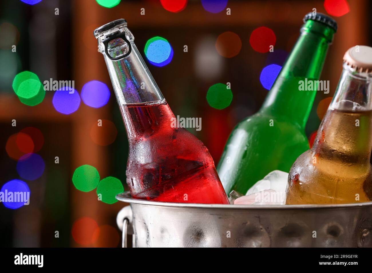 Bucket with bottles of cold beer in bar, closeup Stock Photo - Alamy