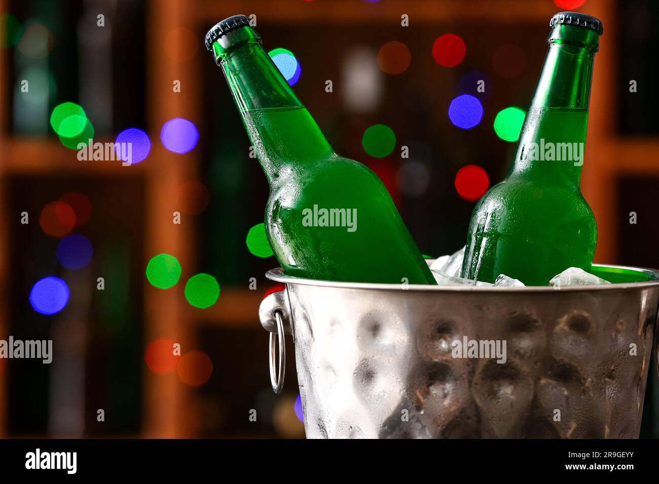 Bucket with bottles of cold beer in bar, closeup Stock Photo - Alamy