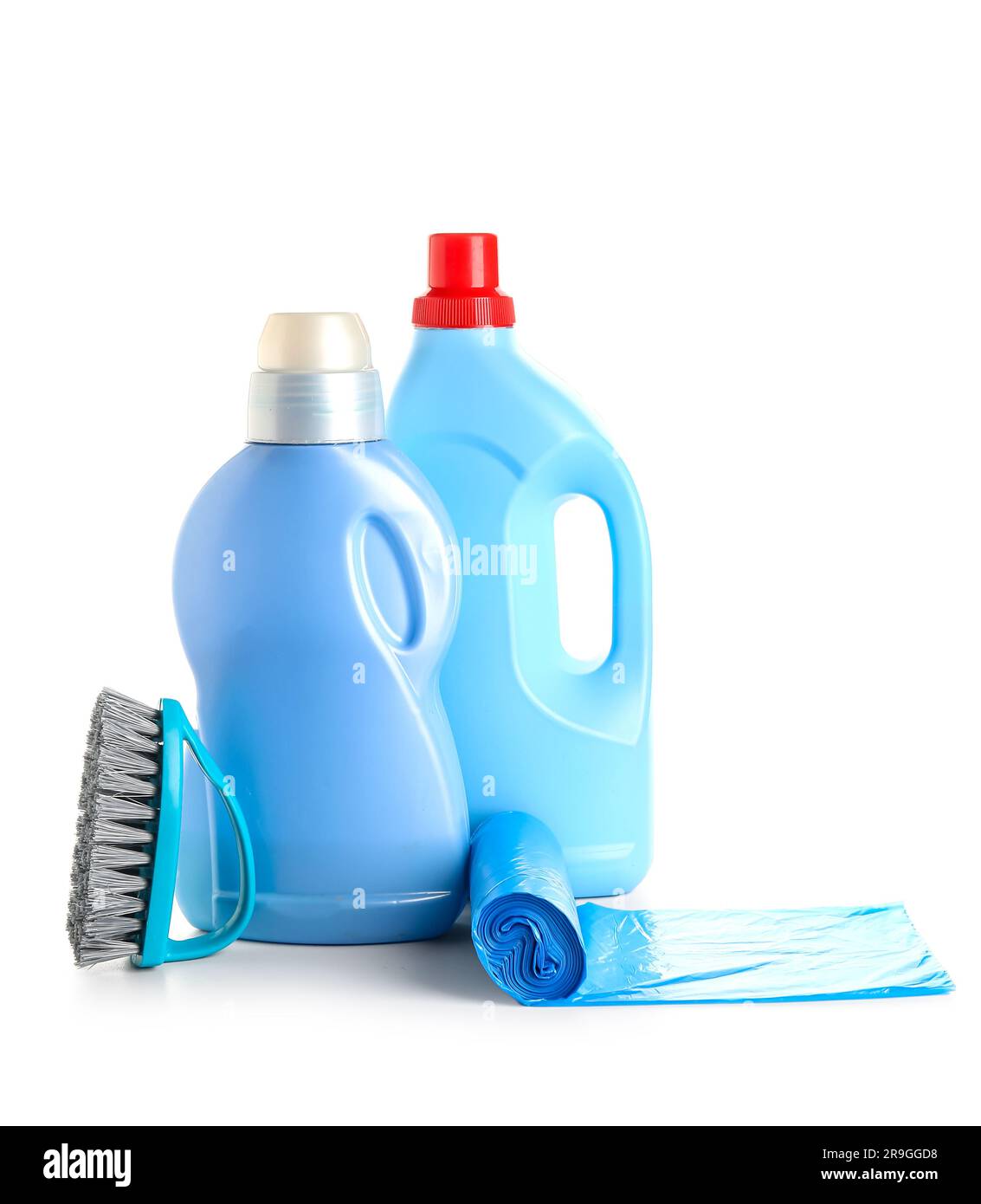Bottles of detergent, brush and roll of garbage bags isolated on white ...
