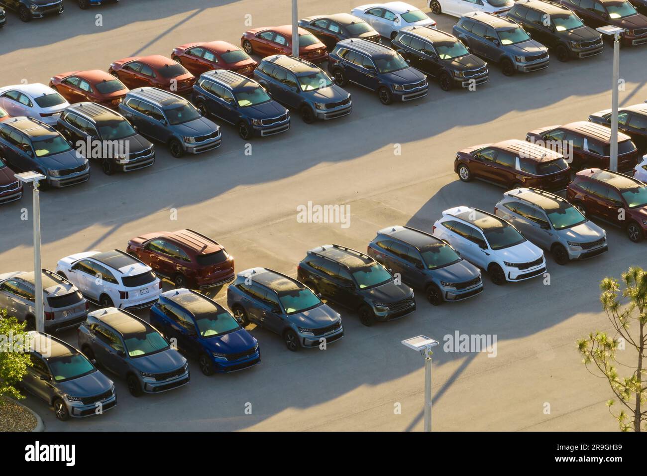 Large parking lot of local dealer with many brand new cars parked for ...