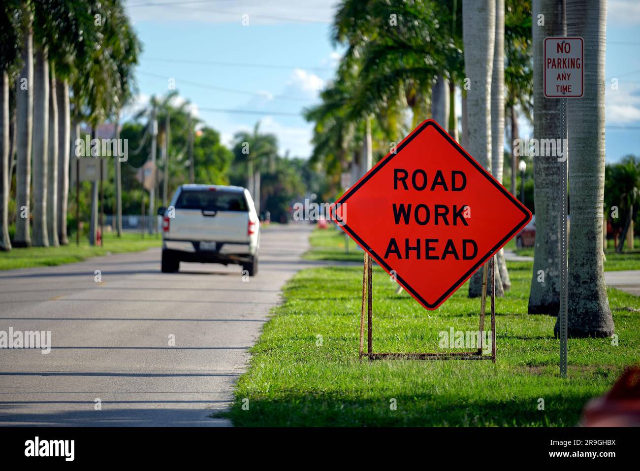 Road work ahead sign on street site as warning to cars about ...