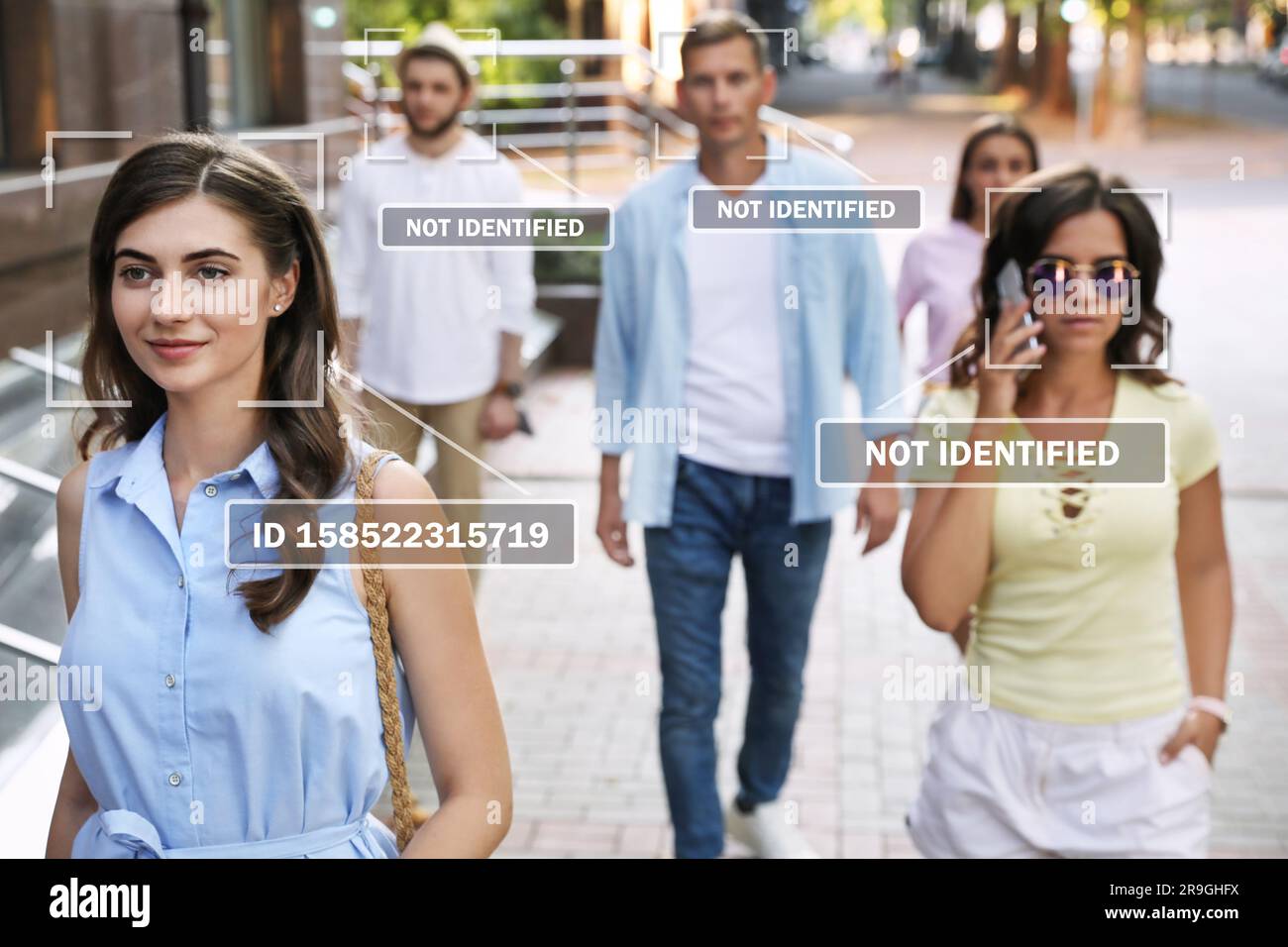 Facial recognition system identifying people on city street. Woman and ...