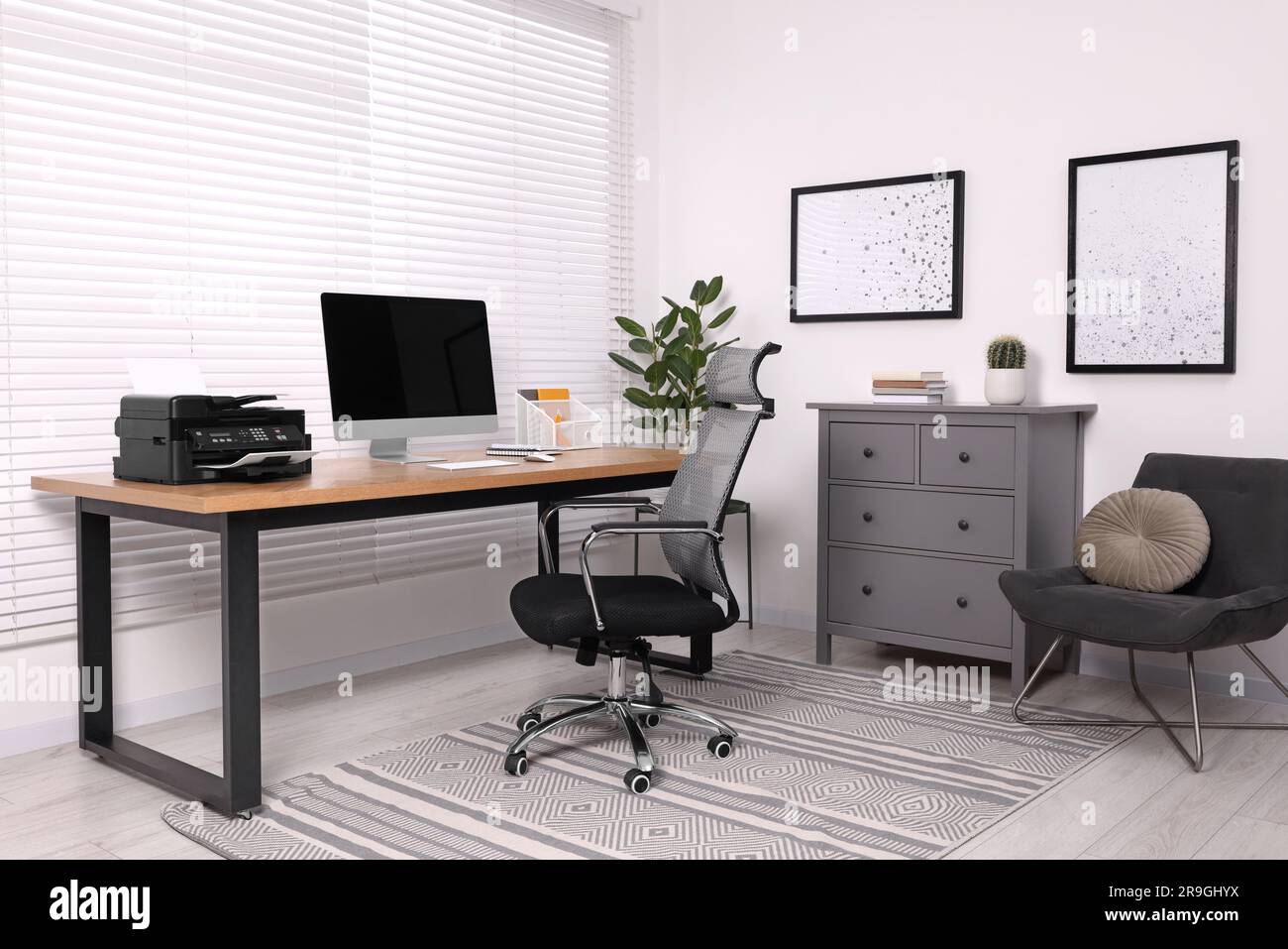 Stylish room interior with desk, modern printer and computer Stock ...