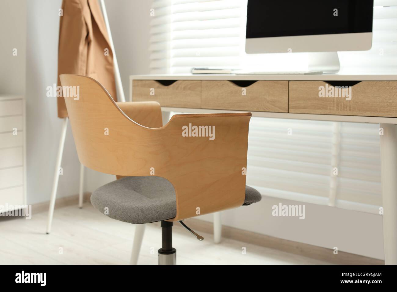 Stylish office chair at workplace in room. Interior design Stock Photo ...