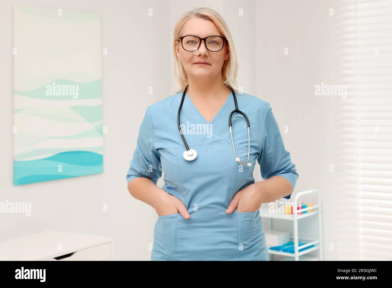Portrait of professional doctor wearing uniform in clinic Stock Photo ...