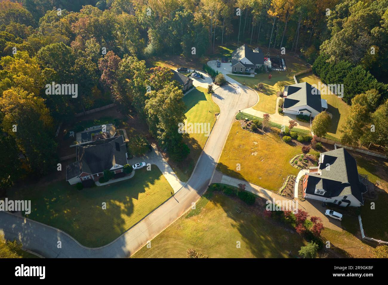View from above of expensive residential houses between yellow fall ...
