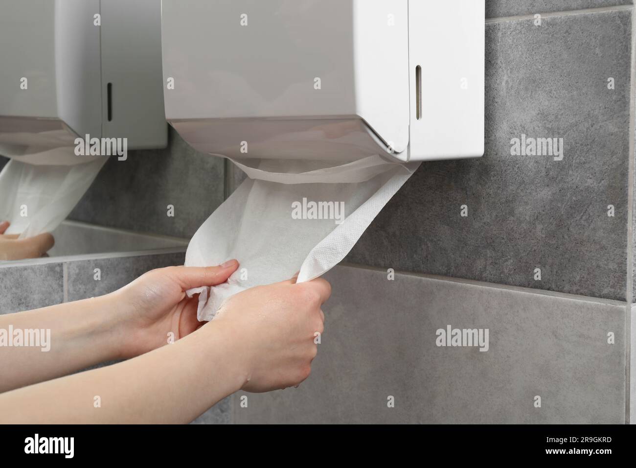 Hands taking toilet paper from hi-res stock photography and images - Alamy