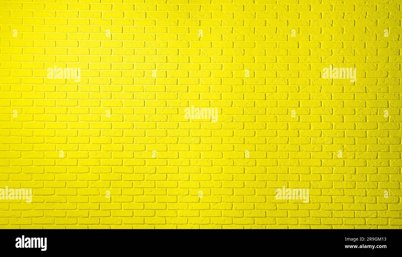 Texture of yellow color brick wall as background Stock Photo - Alamy
