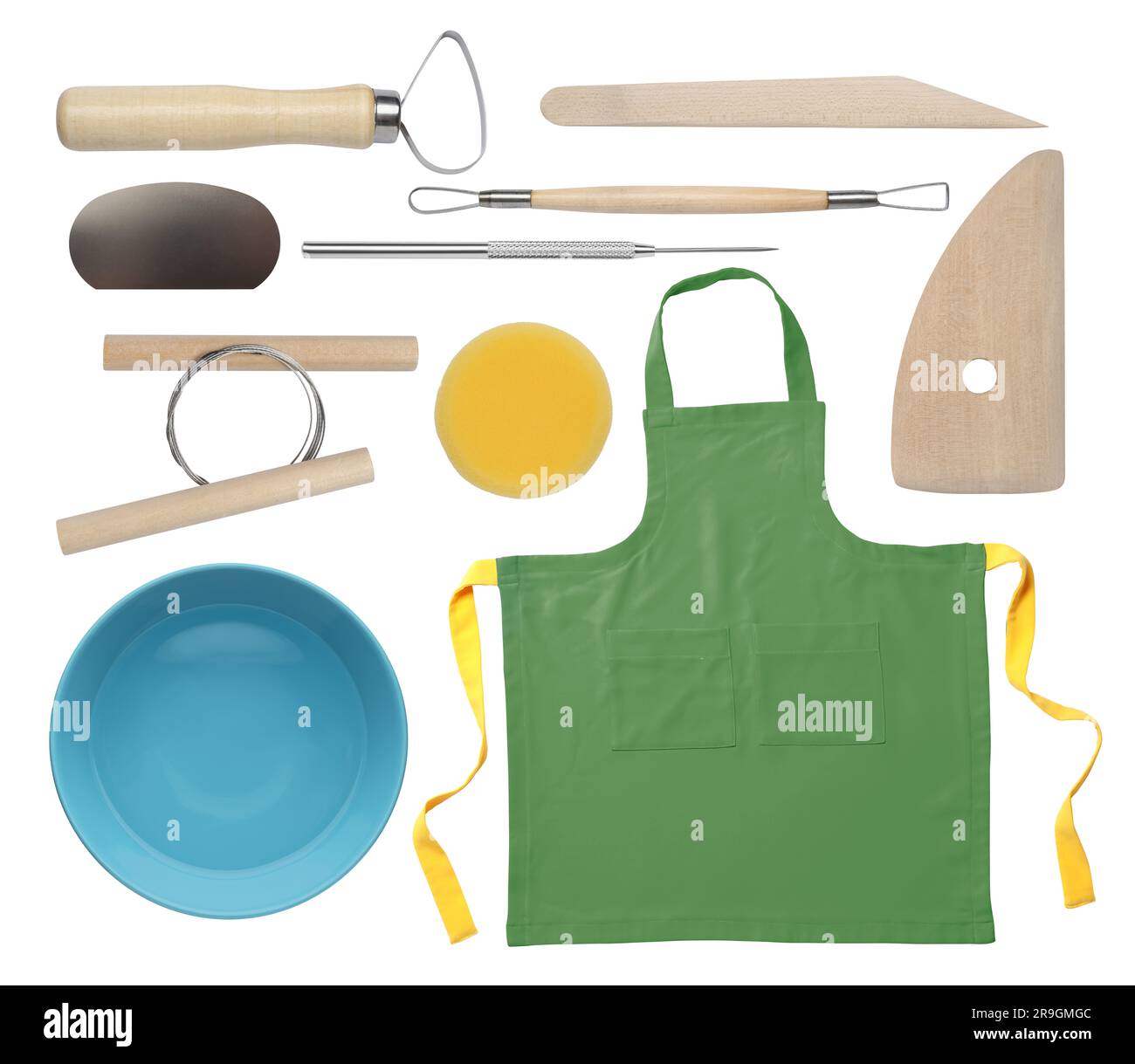 Set of pottery tools, apron and ceramic bowl on white background Stock ...