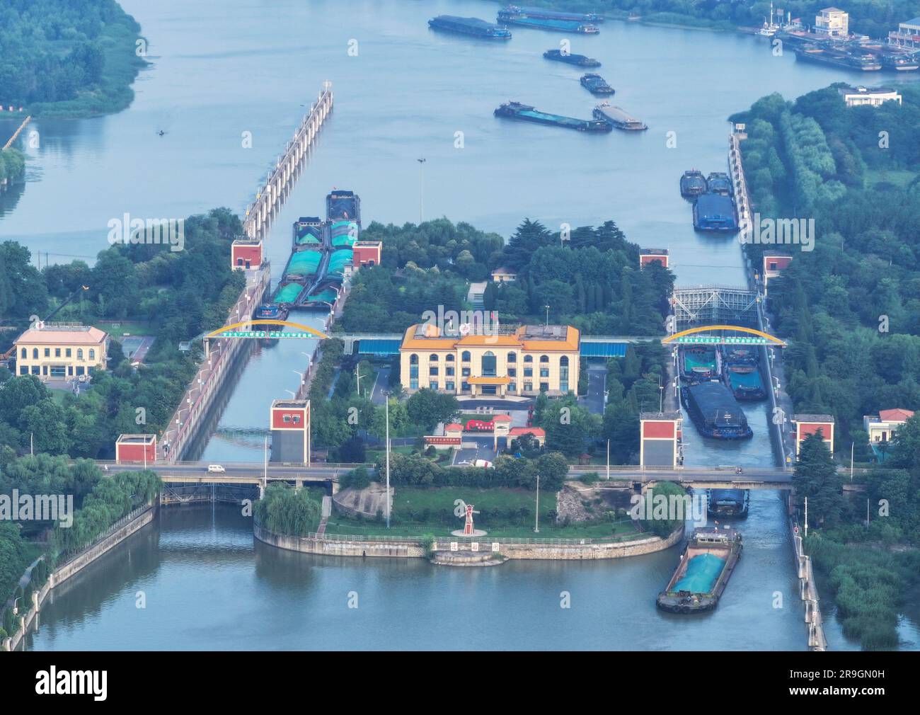 SUQIAN, CHINA - JUNE 27, 2023 - Cargo ships pass through the Suqian ...