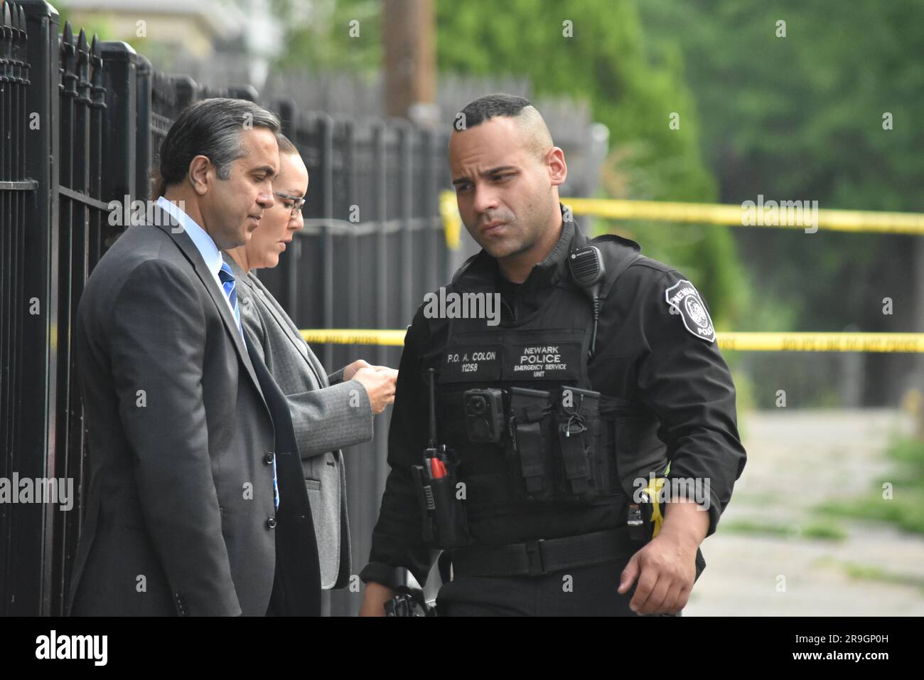Police officers search for clues and mark evidence located at the crime ...