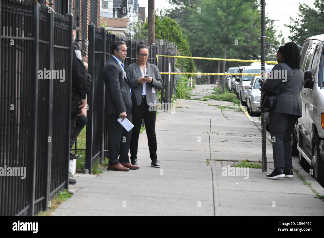 Police officers search for clues and mark evidence located at the crime ...