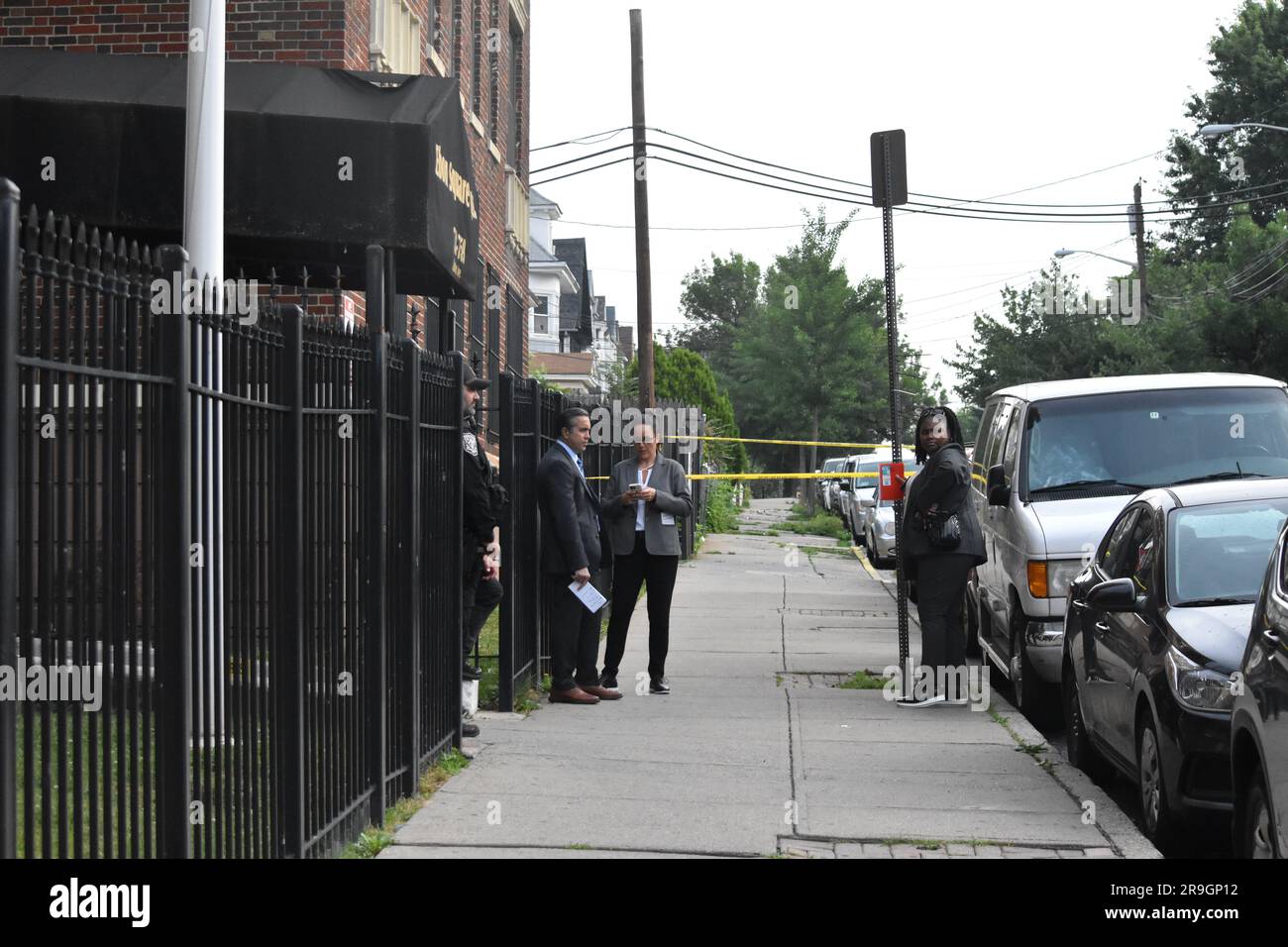 Police officers search for clues and mark evidence located at the crime ...