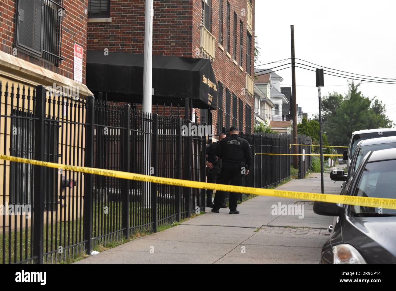 Police officers search for clues and mark evidence located at the crime ...