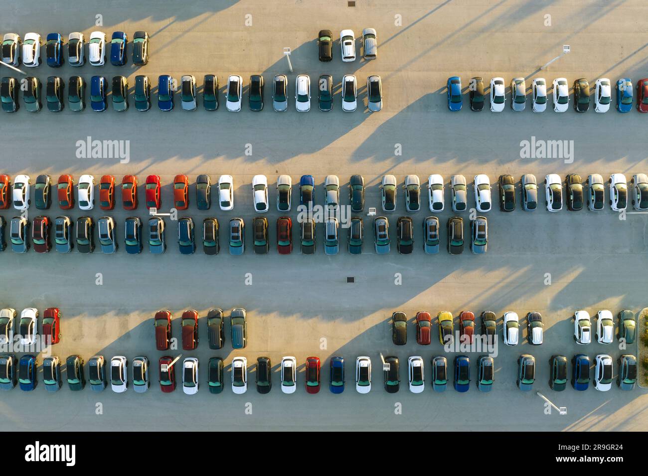 Aerial view of dealership parking lot with many brand new cars for sale ...
