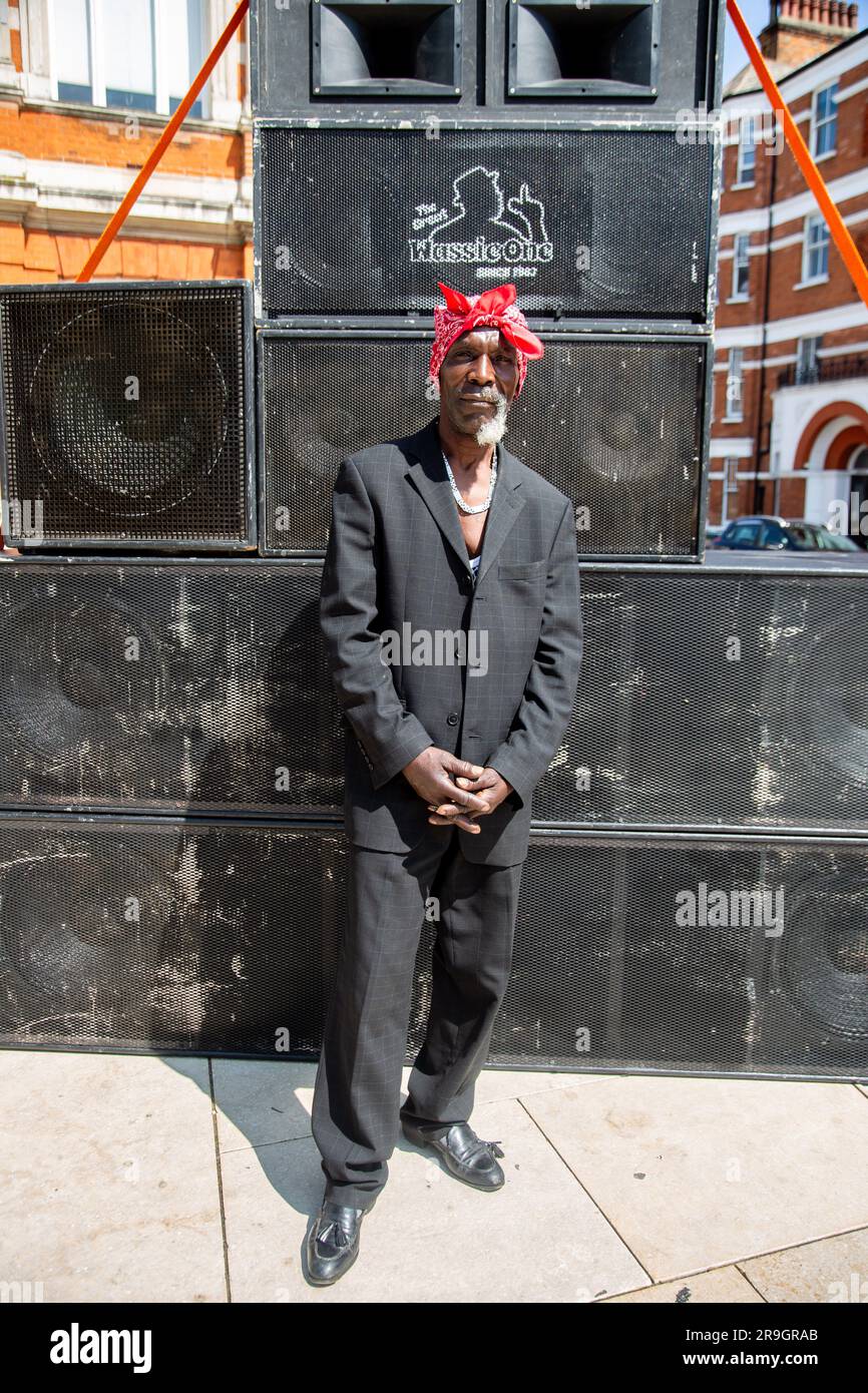 London, UK. 25th June, 2023. A man poses for photos in front of ...