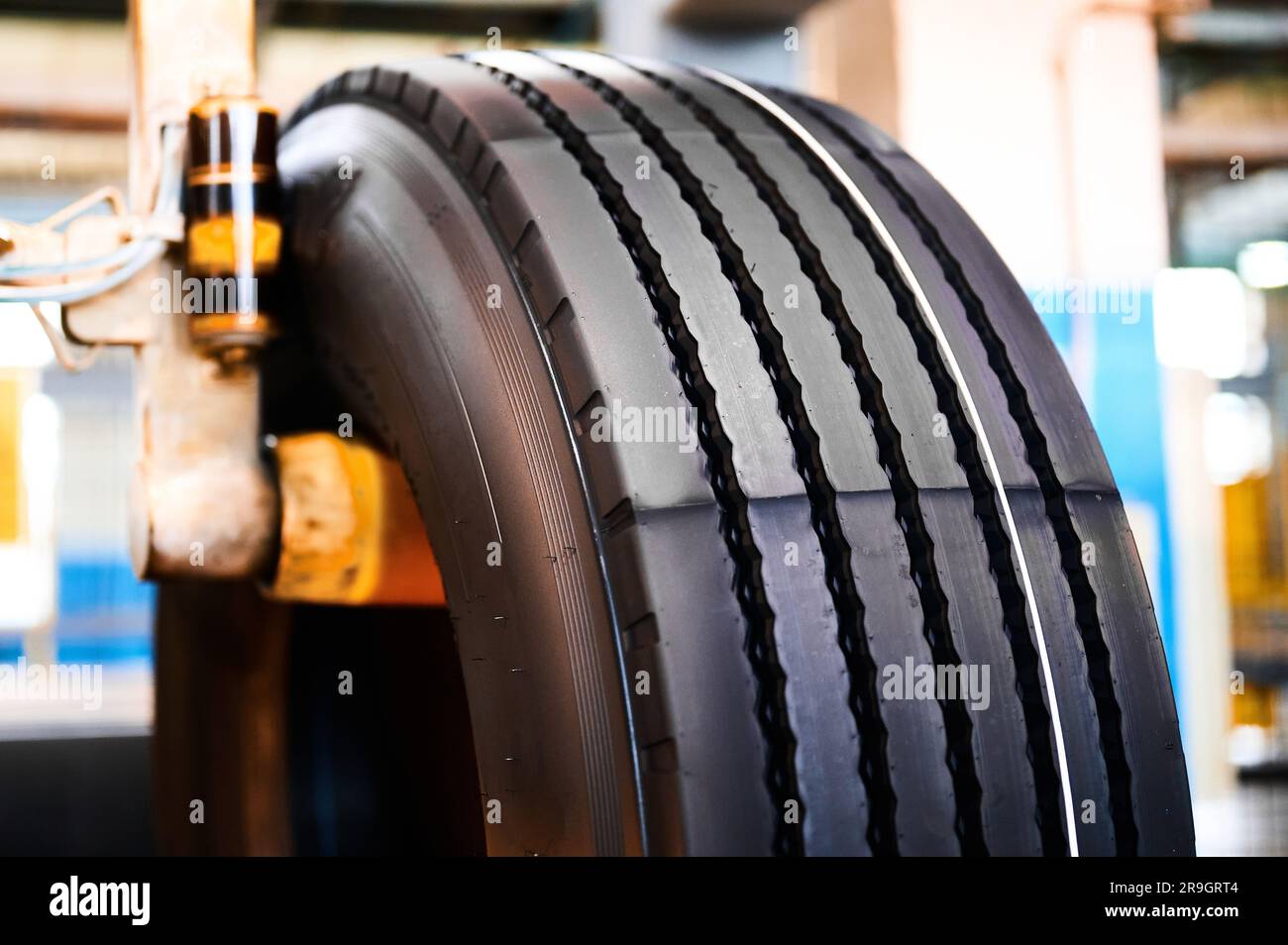 finished tire with yellow and pink color lines on rod at factory Stock ...