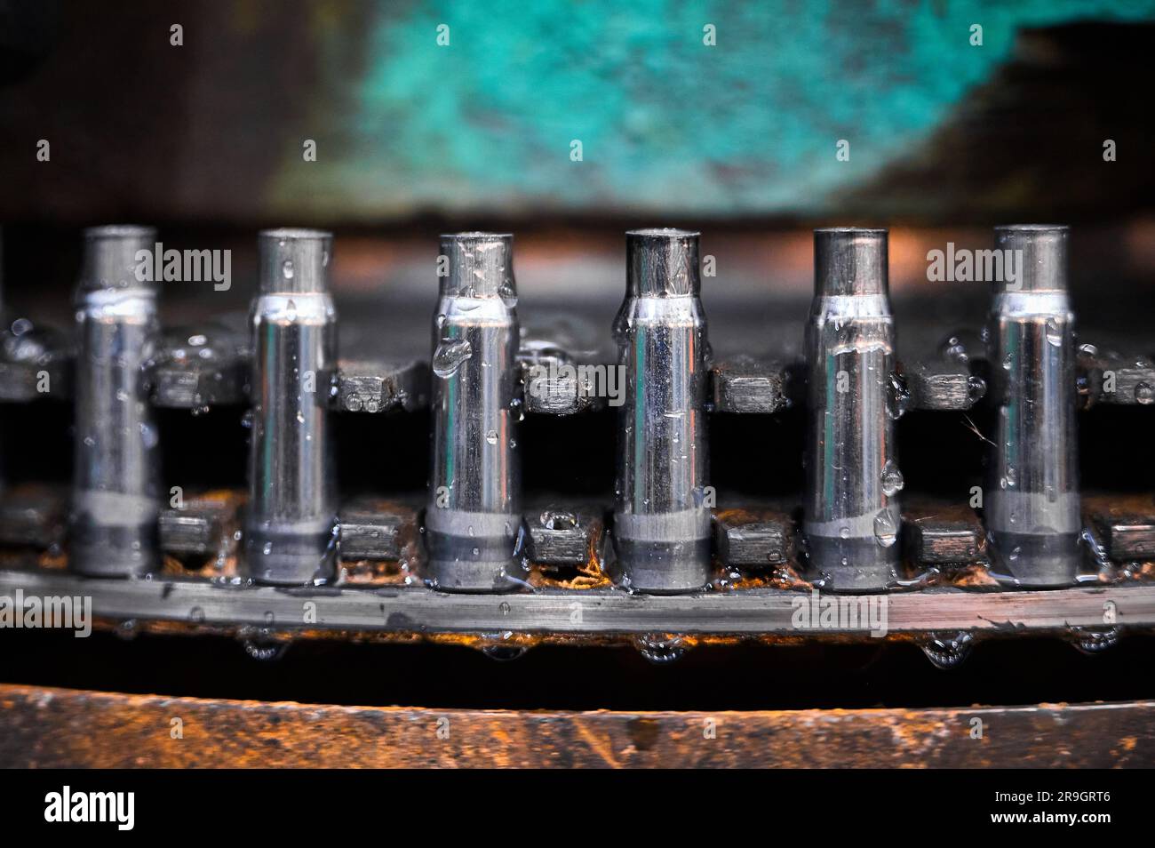 Shell casings transported by vintage equipment at plant Stock Photo - Alamy