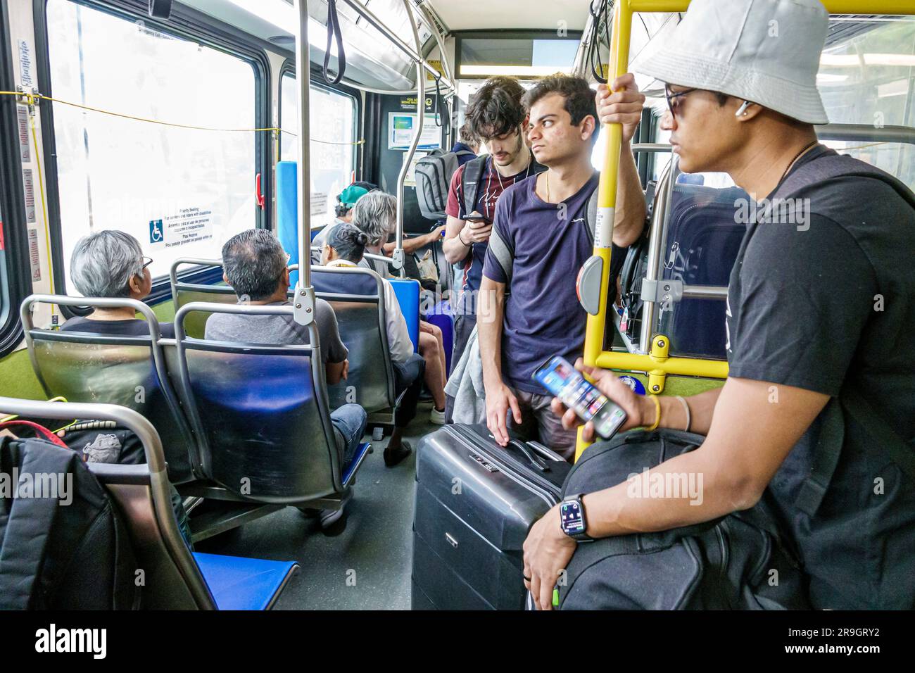 Onboard inside cabin riders passengers sitting standing hi-res stock ...