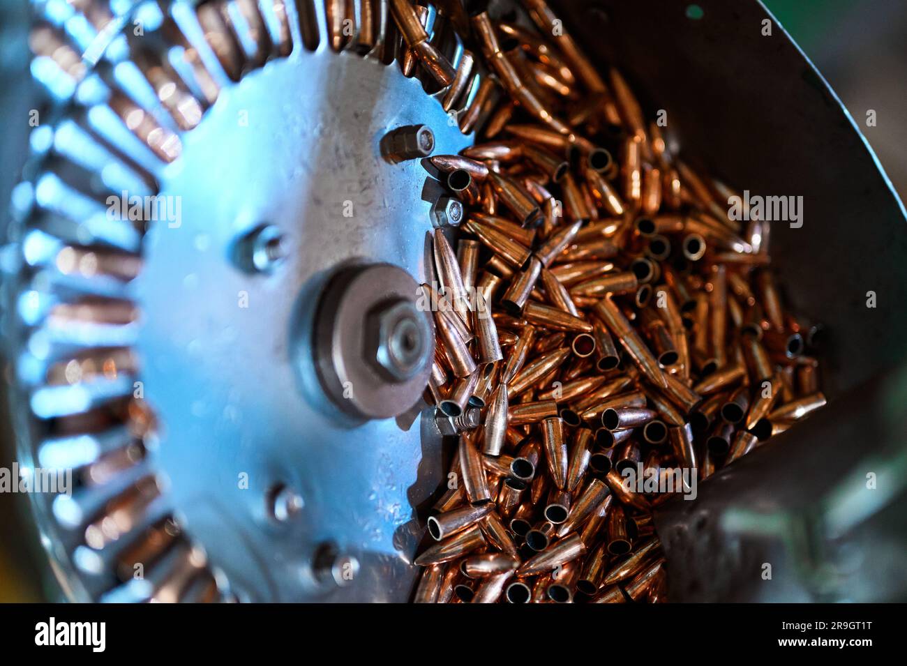 Pile of Copper bullet shells and turning wheel at production line Stock ...