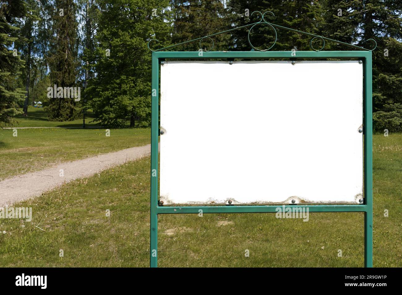 Empty white sign with antique metallic frame in a public park Stock ...