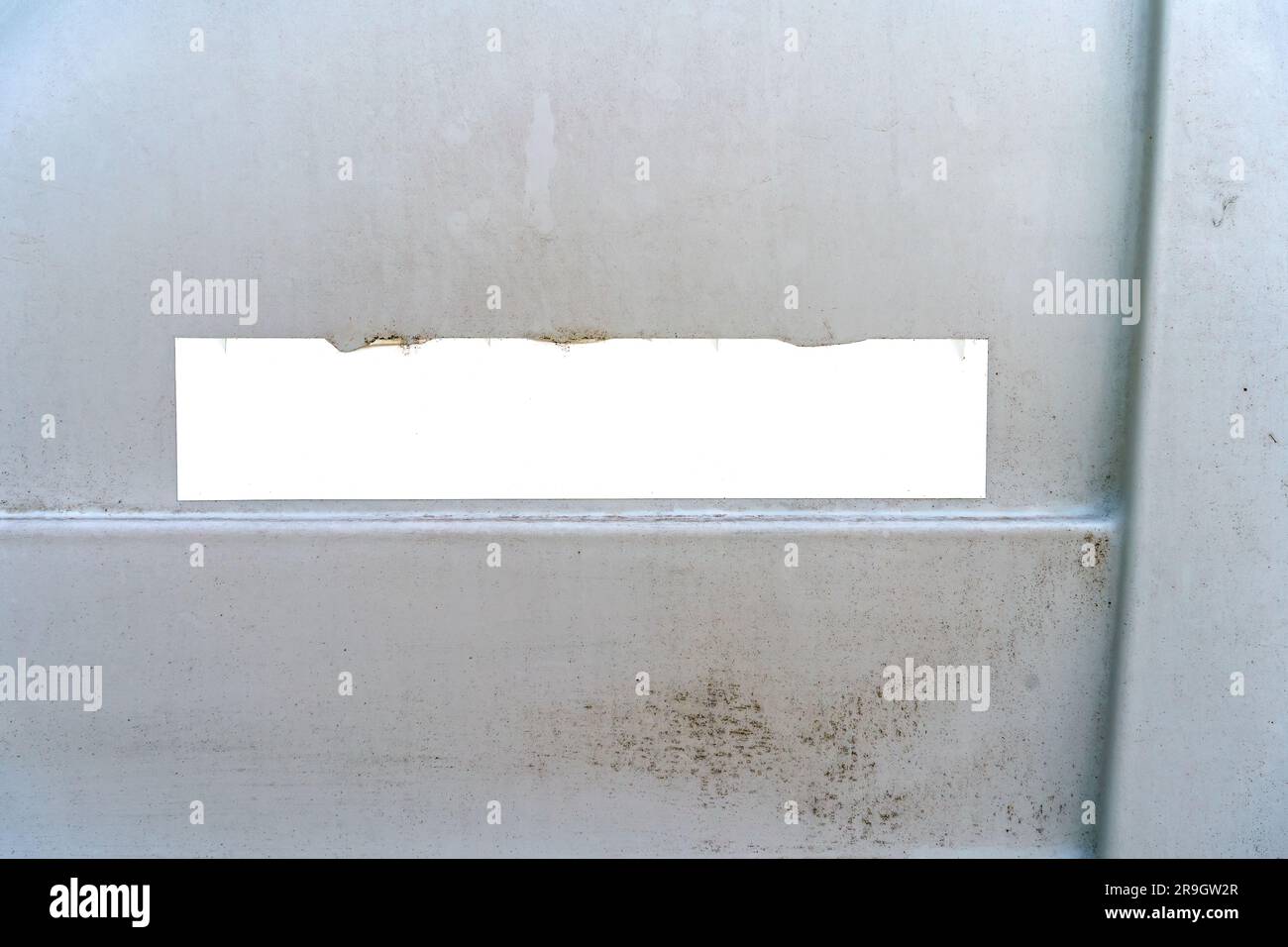 Empty sticker on the side of a dirty plastic trailer cover Stock Photo ...