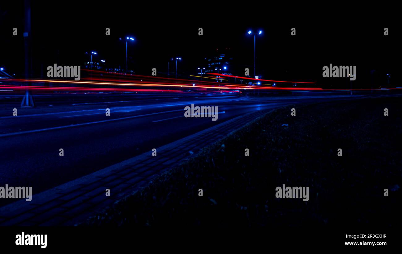 Lights of cars at night. Street line lights. Night highway city. Long ...
