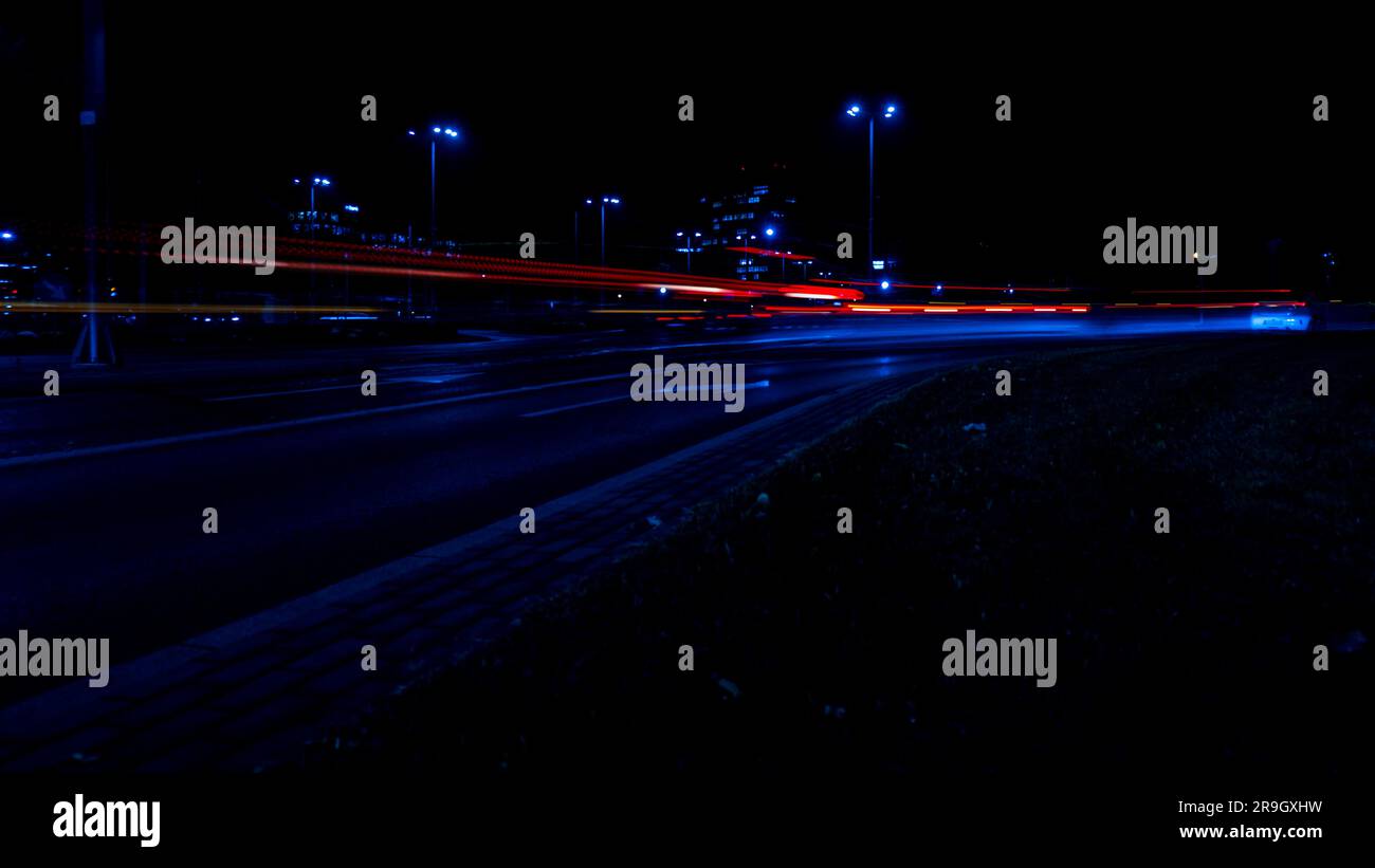 Lights of cars at night. Street line lights. Night highway city. Long ...
