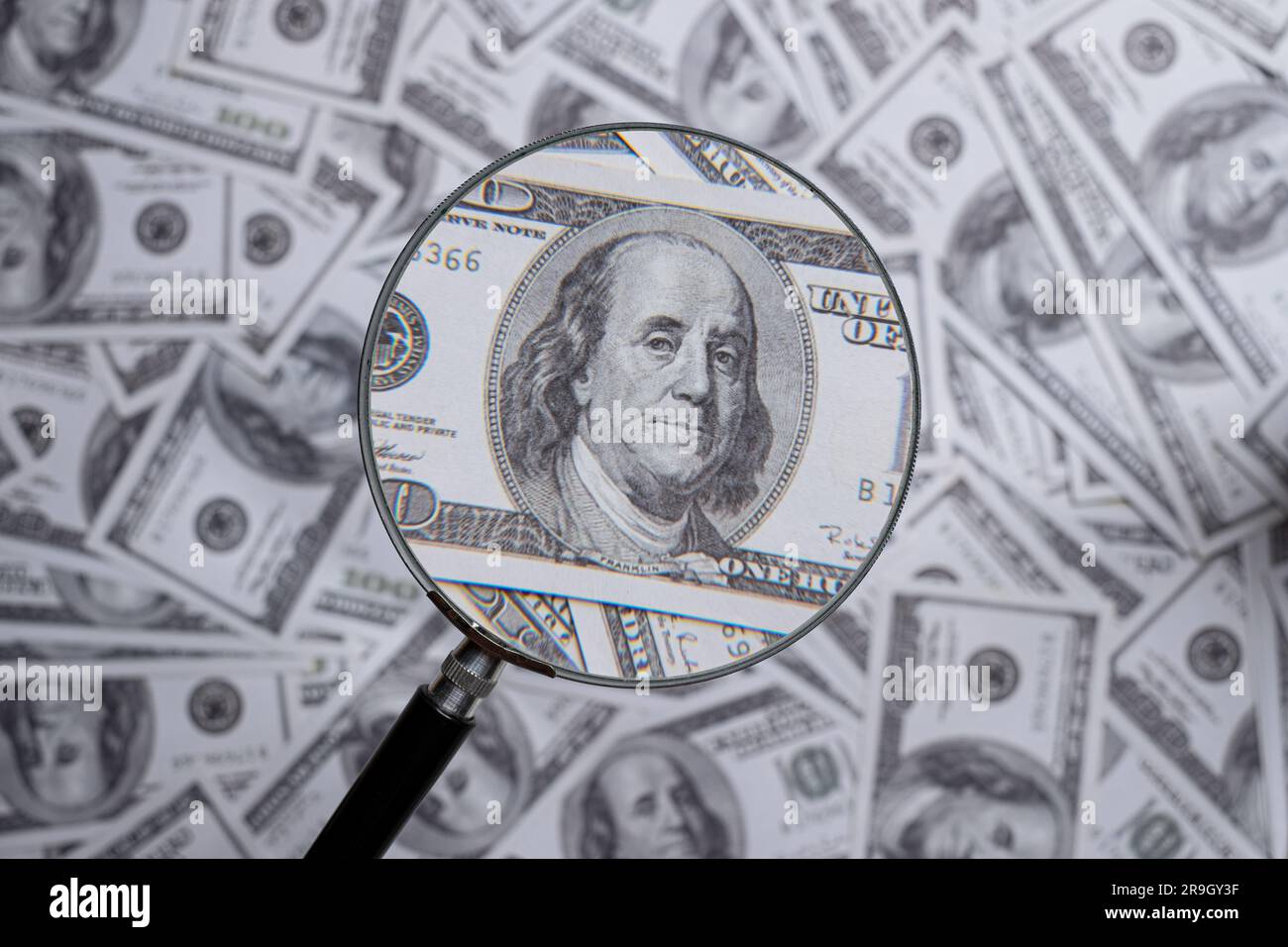 Hundred us dollar bill through magnifying lens checking banknotes Stock ...