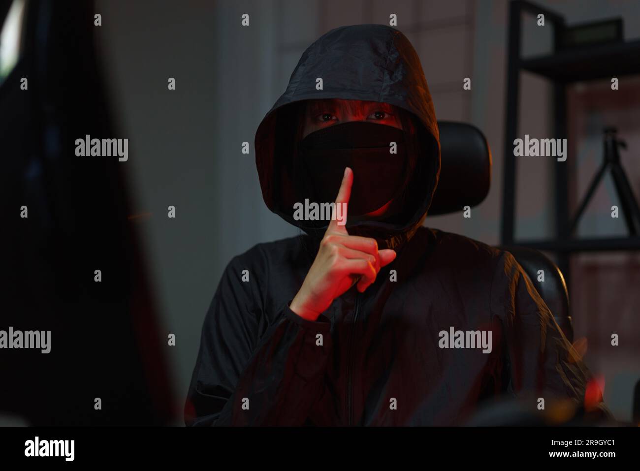 Hacker In Hoodie Hacking Programming System Or Data Of Server On Computer And Making Silent
