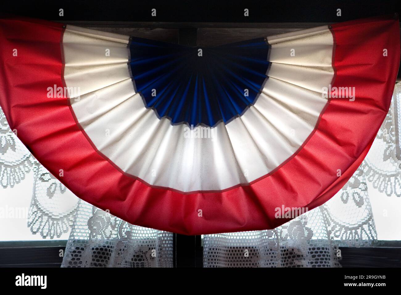 A patriotic display hangs near a window in a cafe Stock Photo - Alamy