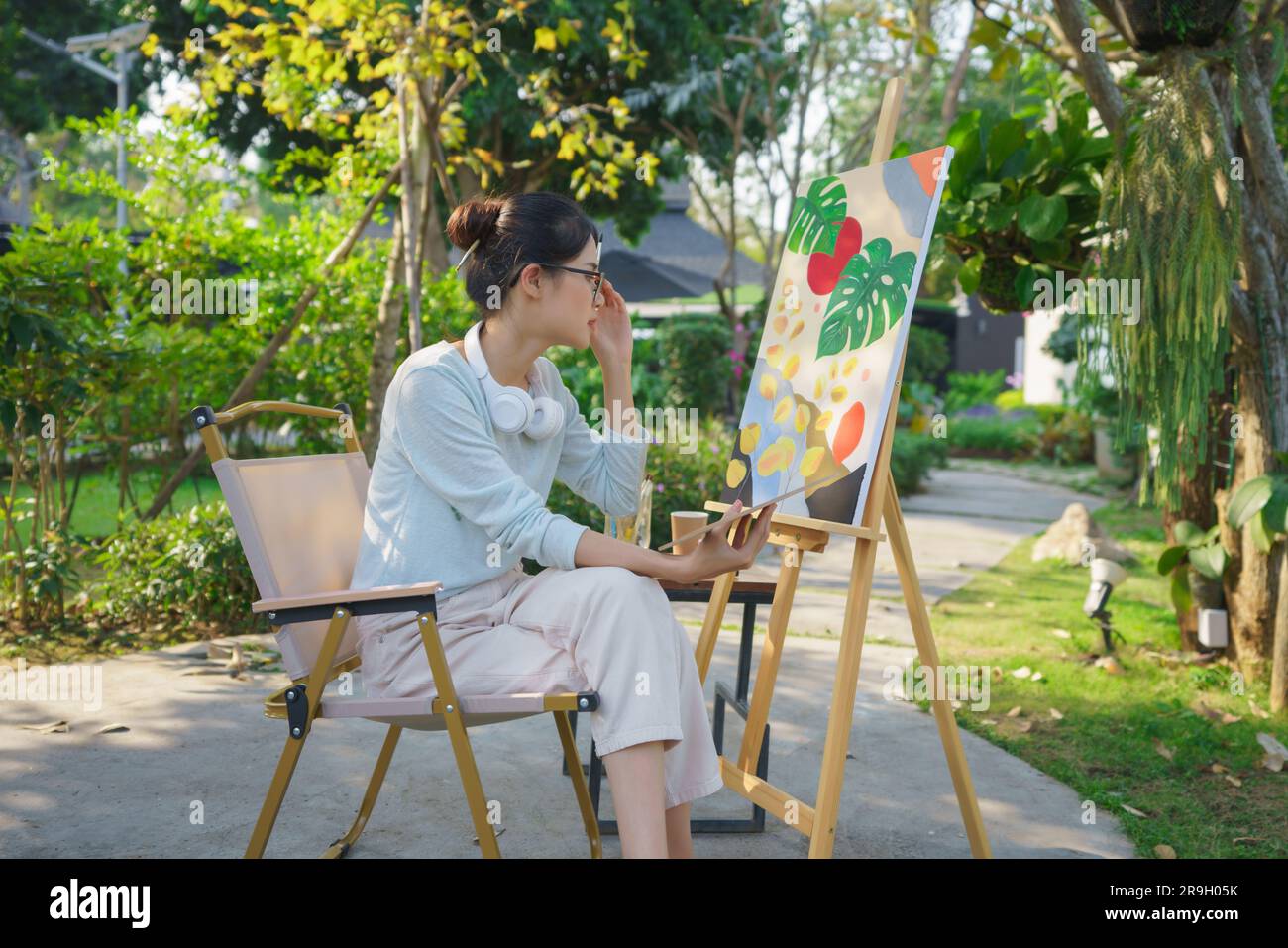 Outdoor activity concept, Female artist thoughtful and looking on ...