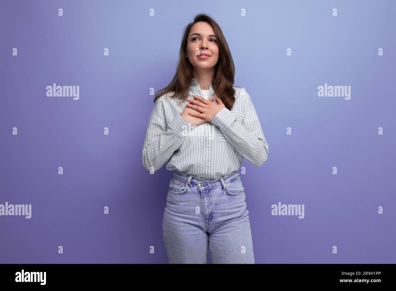 calm slim 25c woman with dark hair in casual clothes Stock Photo - Alamy