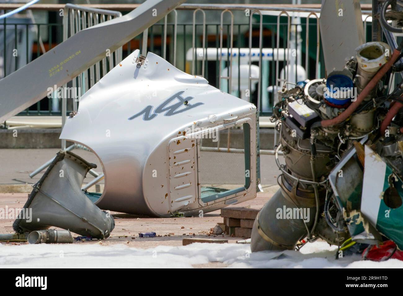 Wreckage lies around the scene of a helicopter crash, Viaduct Harbour ...