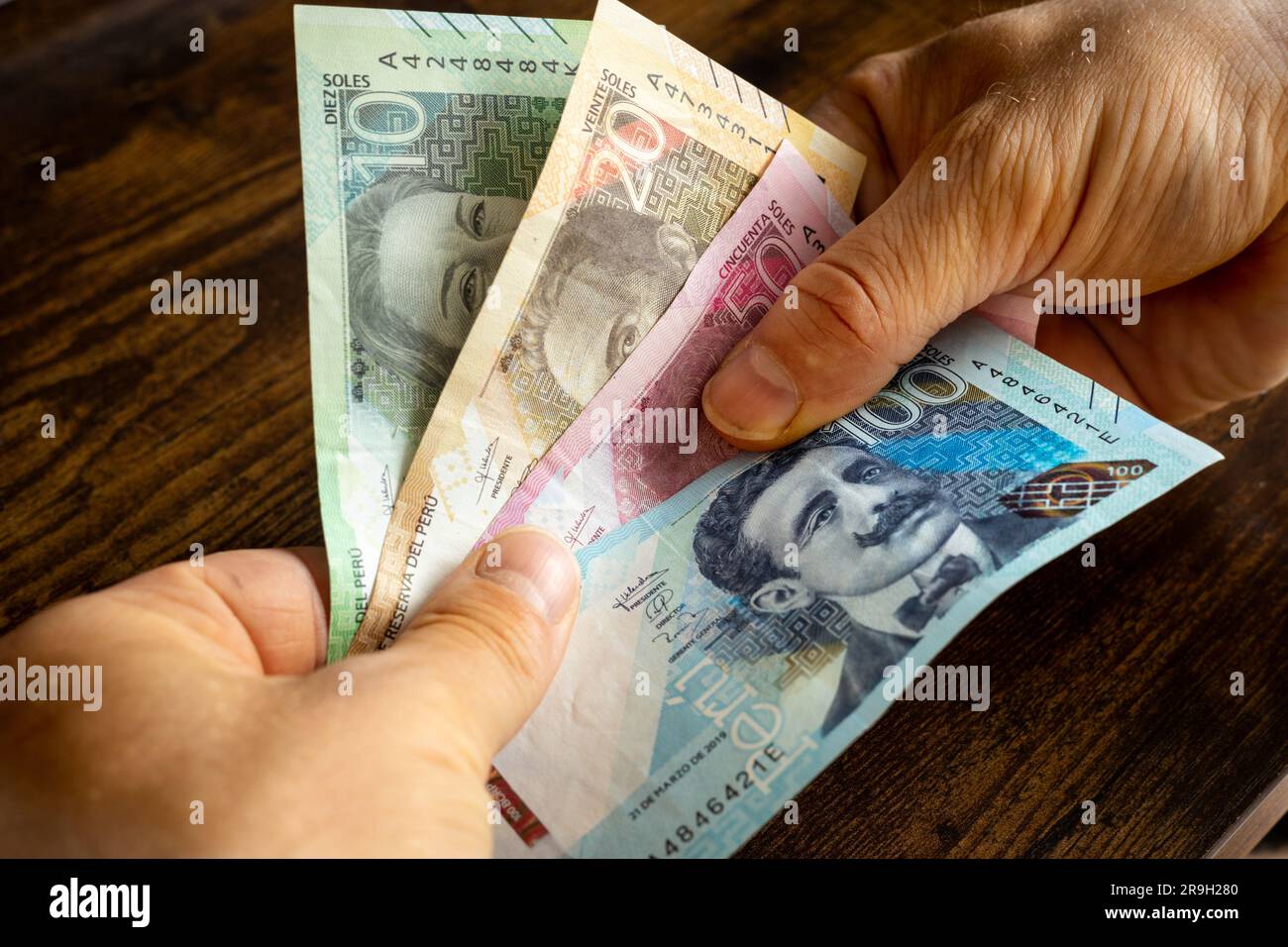 Peru money, Peruvian banknotes, soles, passing from hand to hand ...