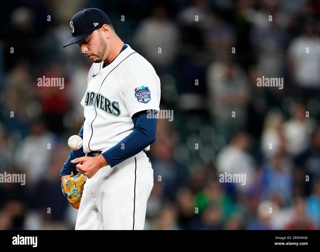 Seattle Mariners relief pitcher Tayler Saucedo tosses a ball as he is ...