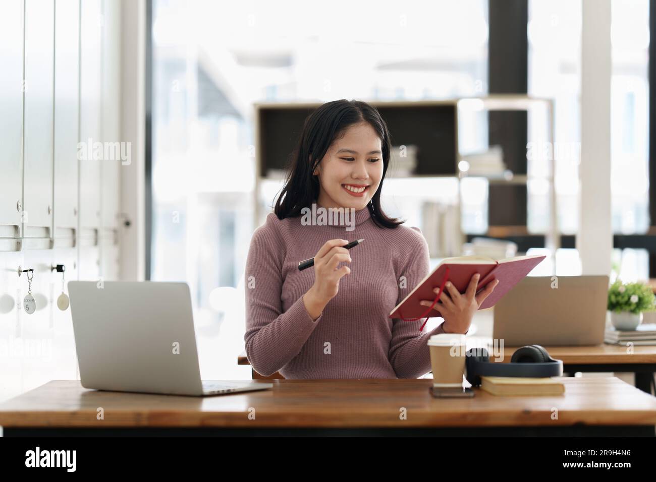 Young student studying in classroom at college. Student working at ...