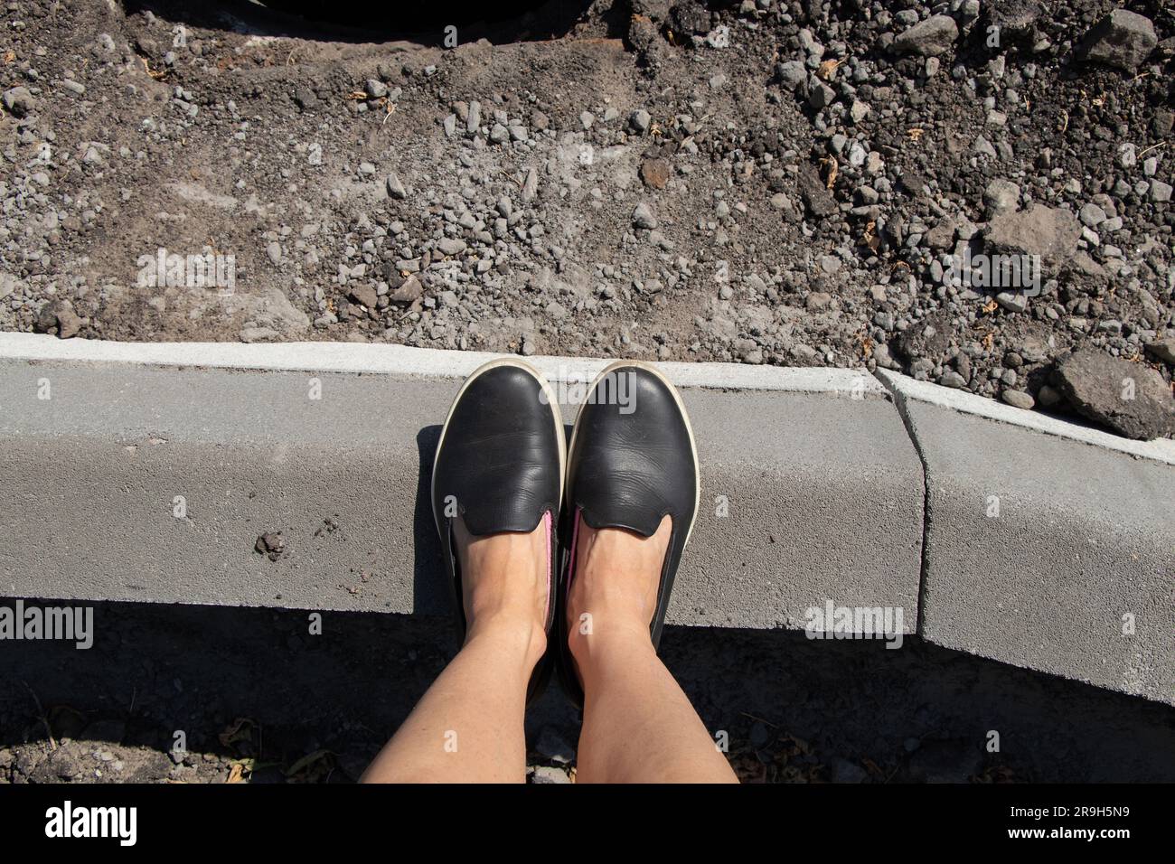 Legs in black shoes hi-res stock photography and images - Alamy