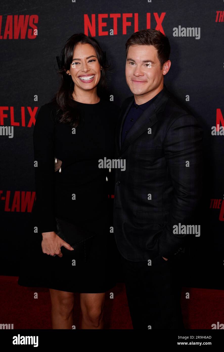 Adam Devine, right, poses with his wife Chloe Bridges at a special ...