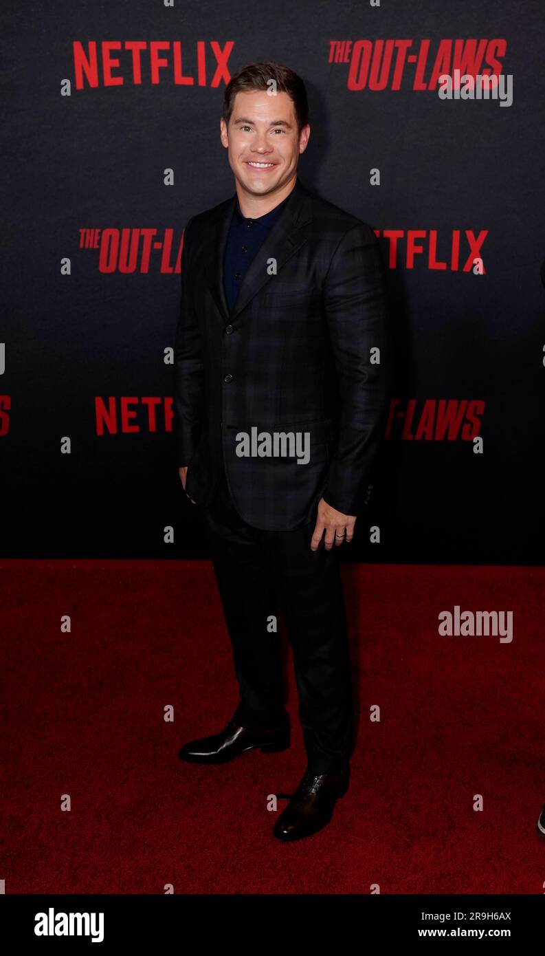 Adam Devine poses at a special screening of the film "The Out-Laws ...
