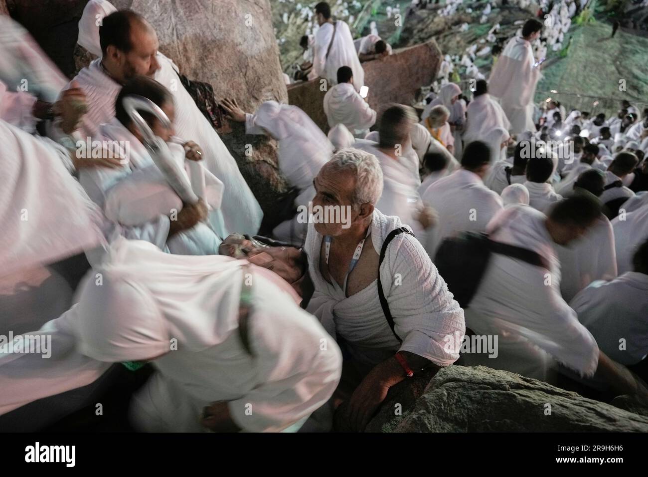 Muslim pilgrims ascend the rocky hill known as the Mountain of Mercy ...