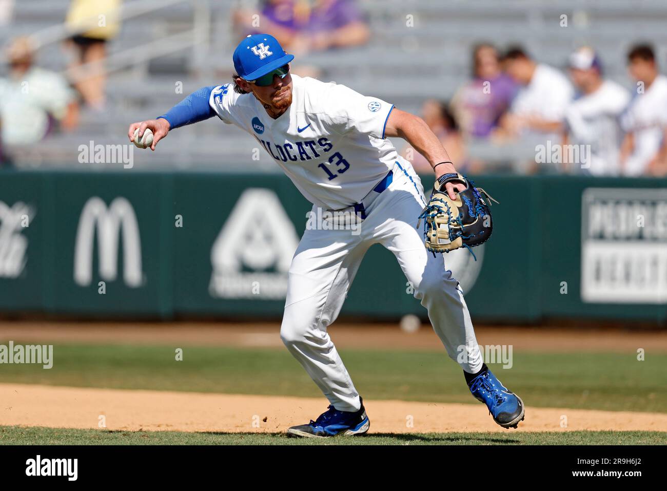Kentucky infielder James McCoy (13) warms up before an NCAA college ...