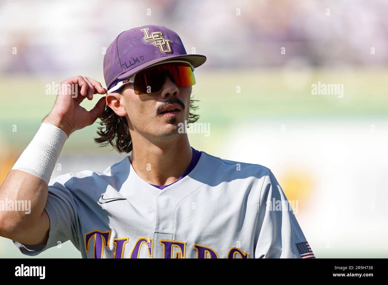 LSU infielder Jordan Thompson (4) warms up before an NCAA college ...