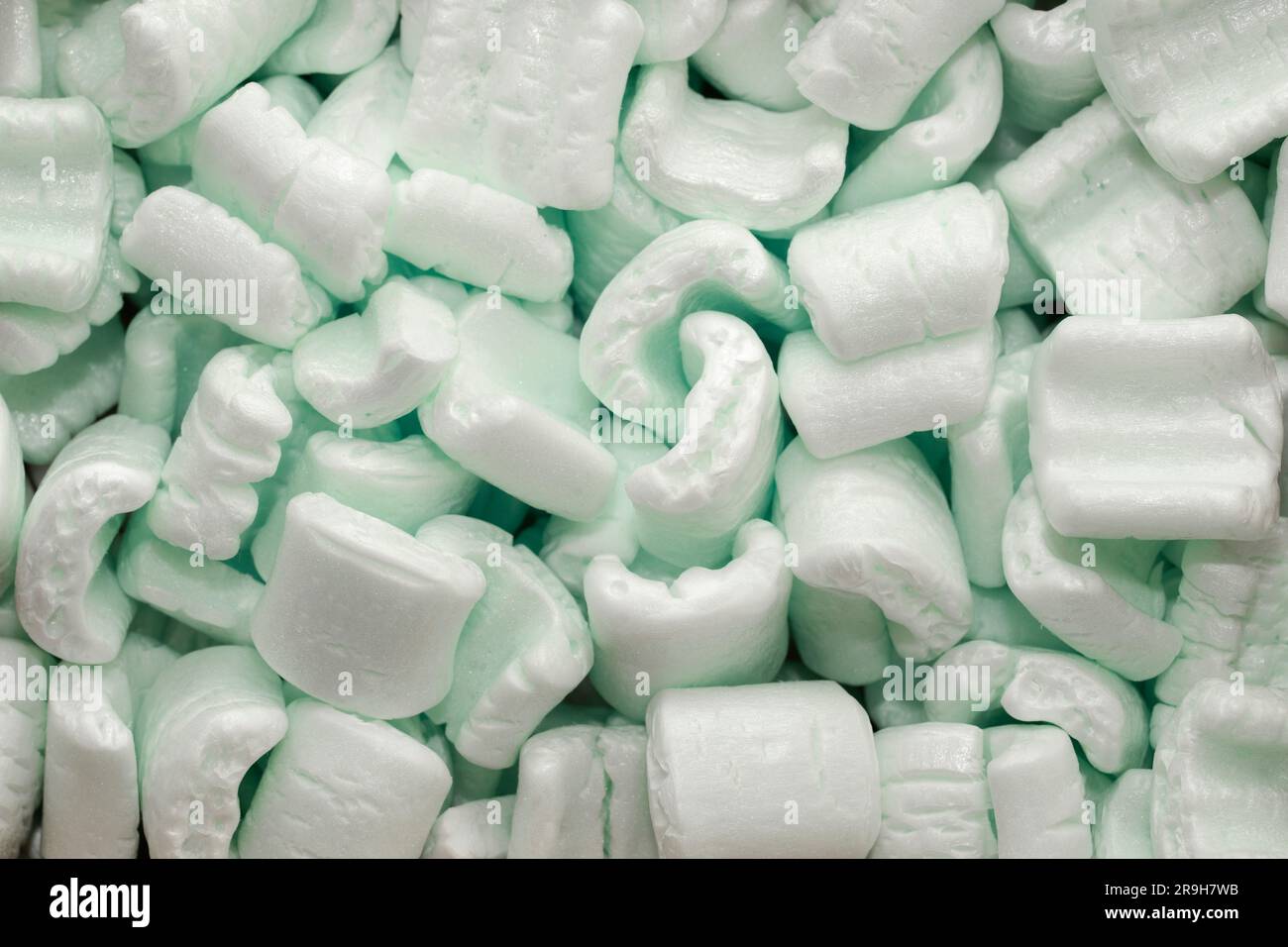 detailed background of many green packing foam pieces Stock Photo - Alamy