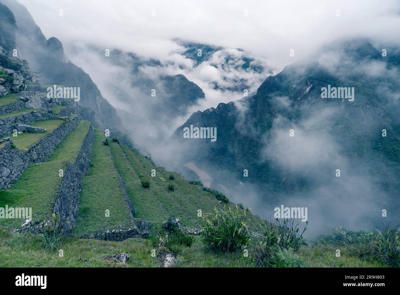 ancient Inca terraces on mountain slope at Machu Picchu site in Peru ...
