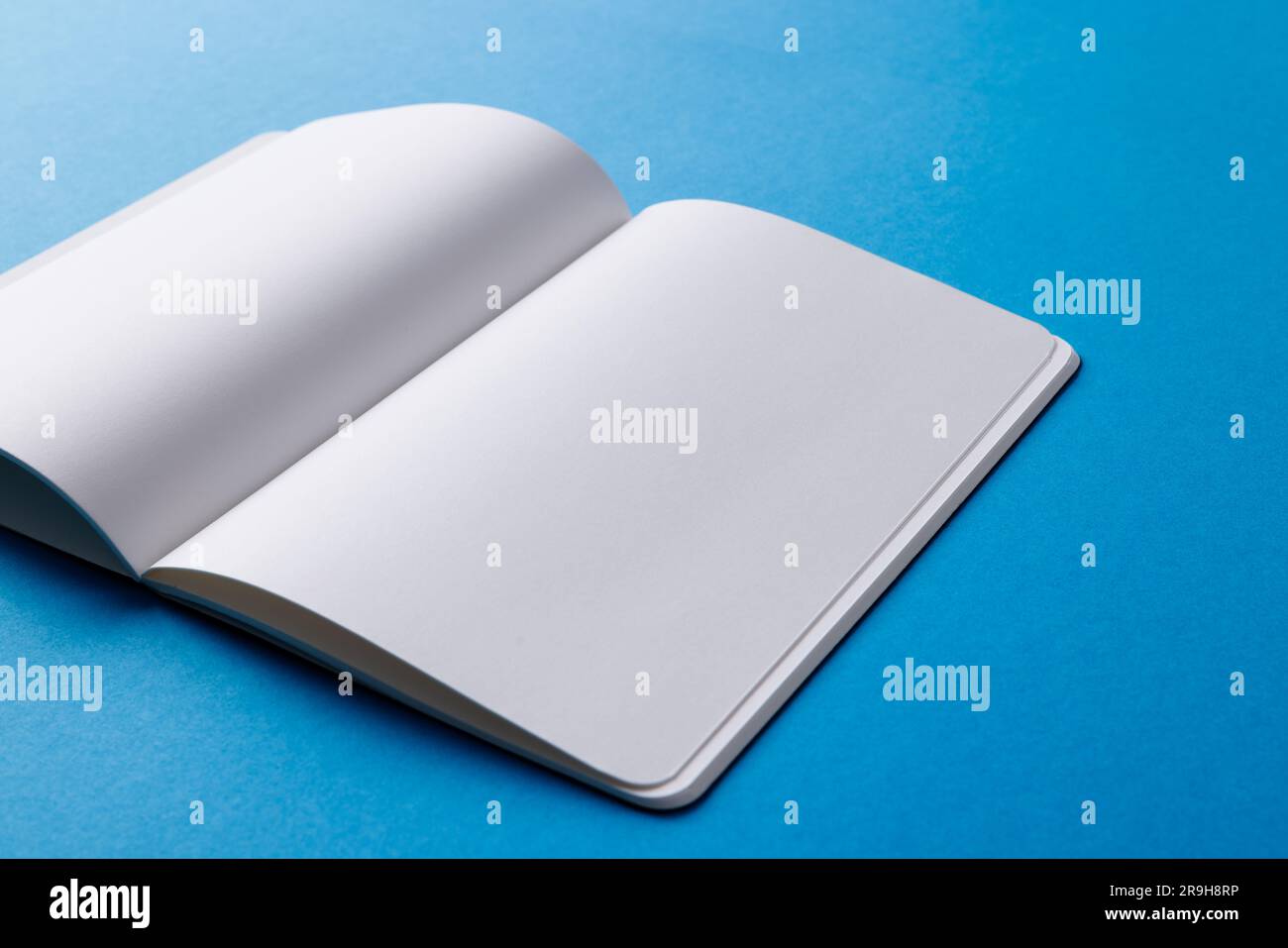 Open book blue background hi-res stock photography and images - Alamy