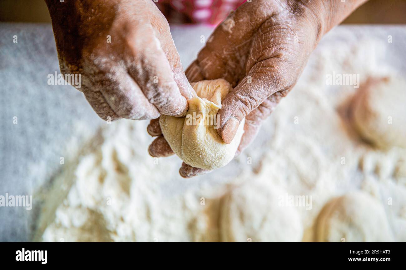 Homemade cakes dough in the women's hands. Process of making pies, hand ...