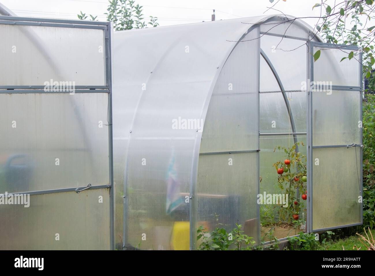White big opened greenhouse in a country Stock Photo - Alamy