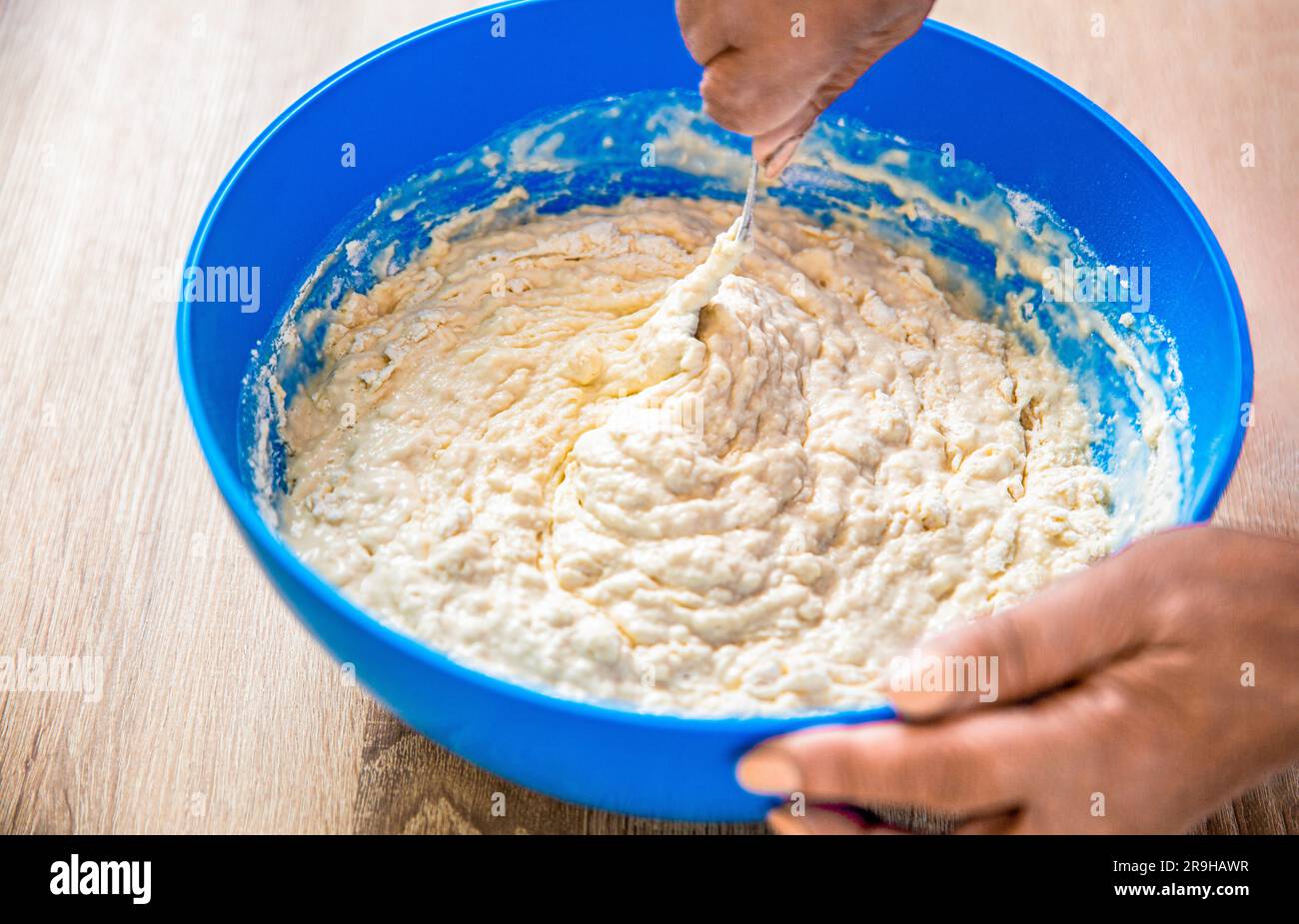 Hands old woman who mixes dough. Cooking at home. Woman stirs around ...